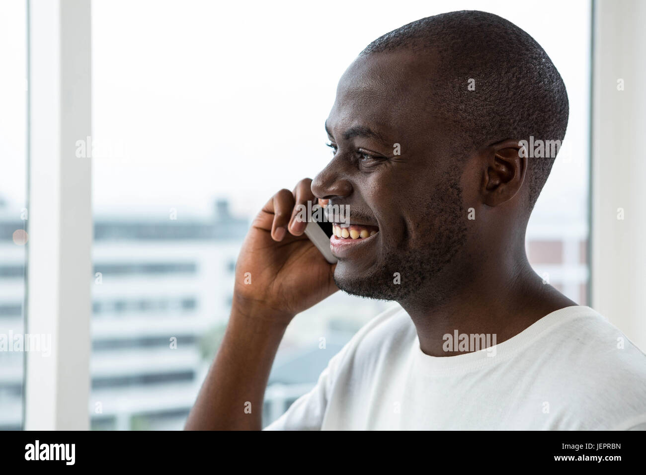 Man near window on hi-res stock photography and images - Alamy