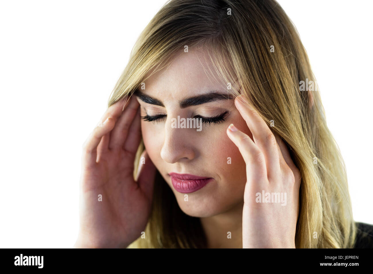 Woman touching her temples Stock Photo - Alamy