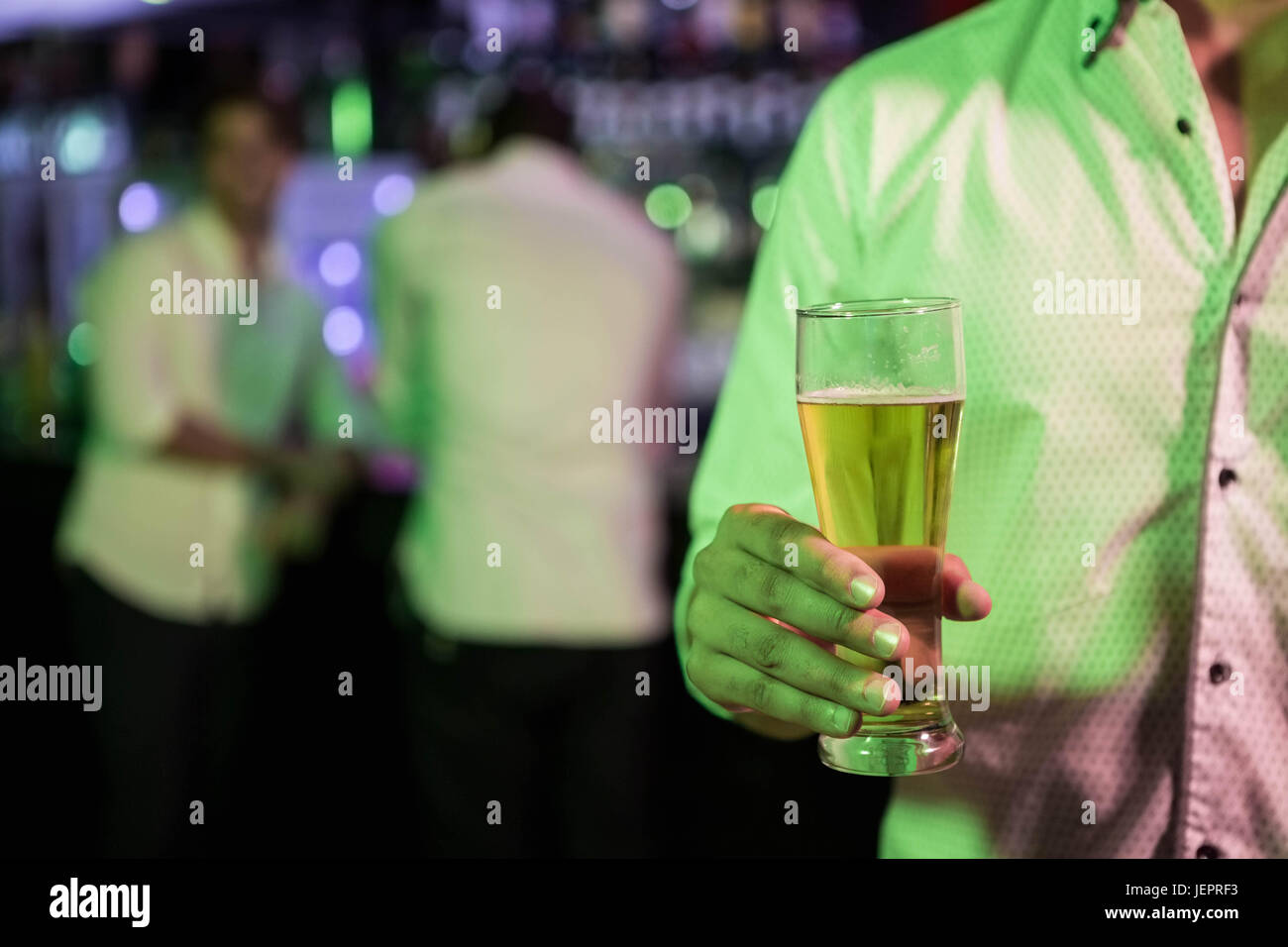 Man posing with glass of beer Stock Photo - Alamy