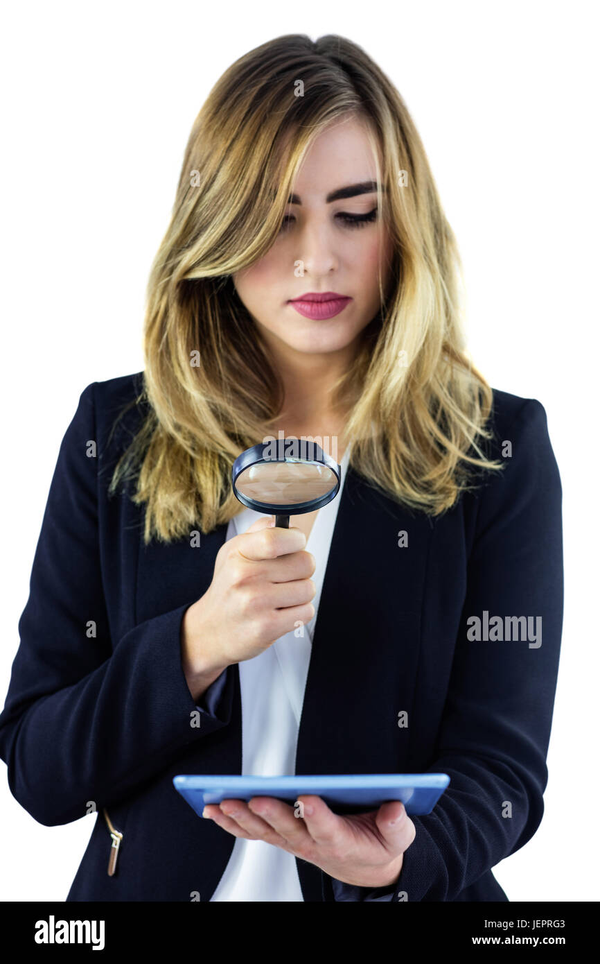 Woman using magnifying glass Stock Photo - Alamy