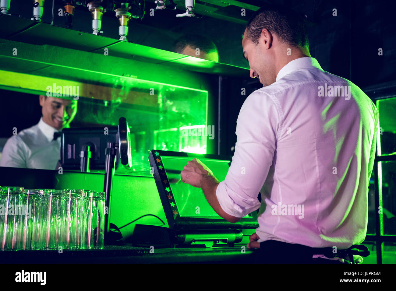 Waiter preparing a bill Stock Photo - Alamy