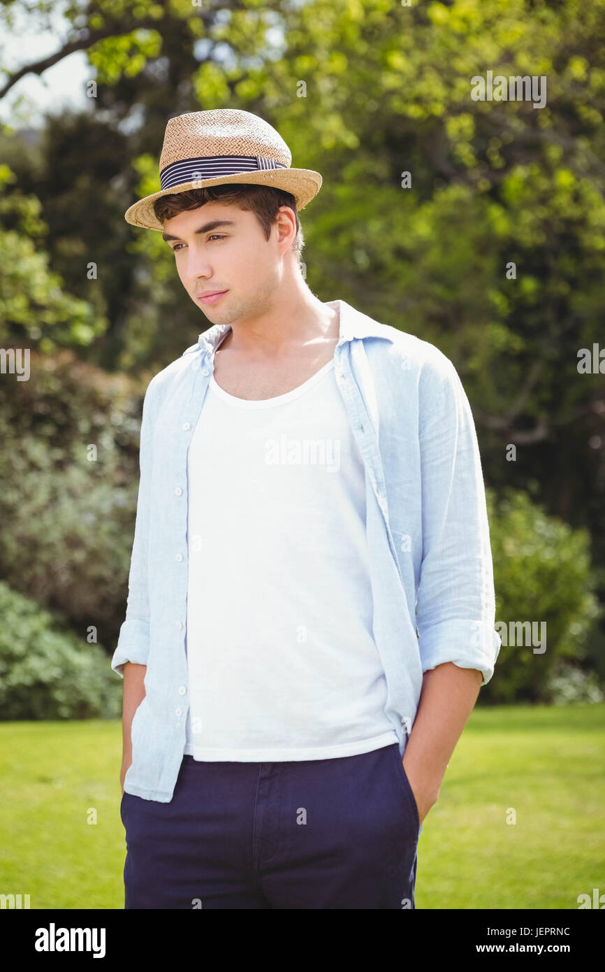 Young man standing in garden Stock Photo - Alamy