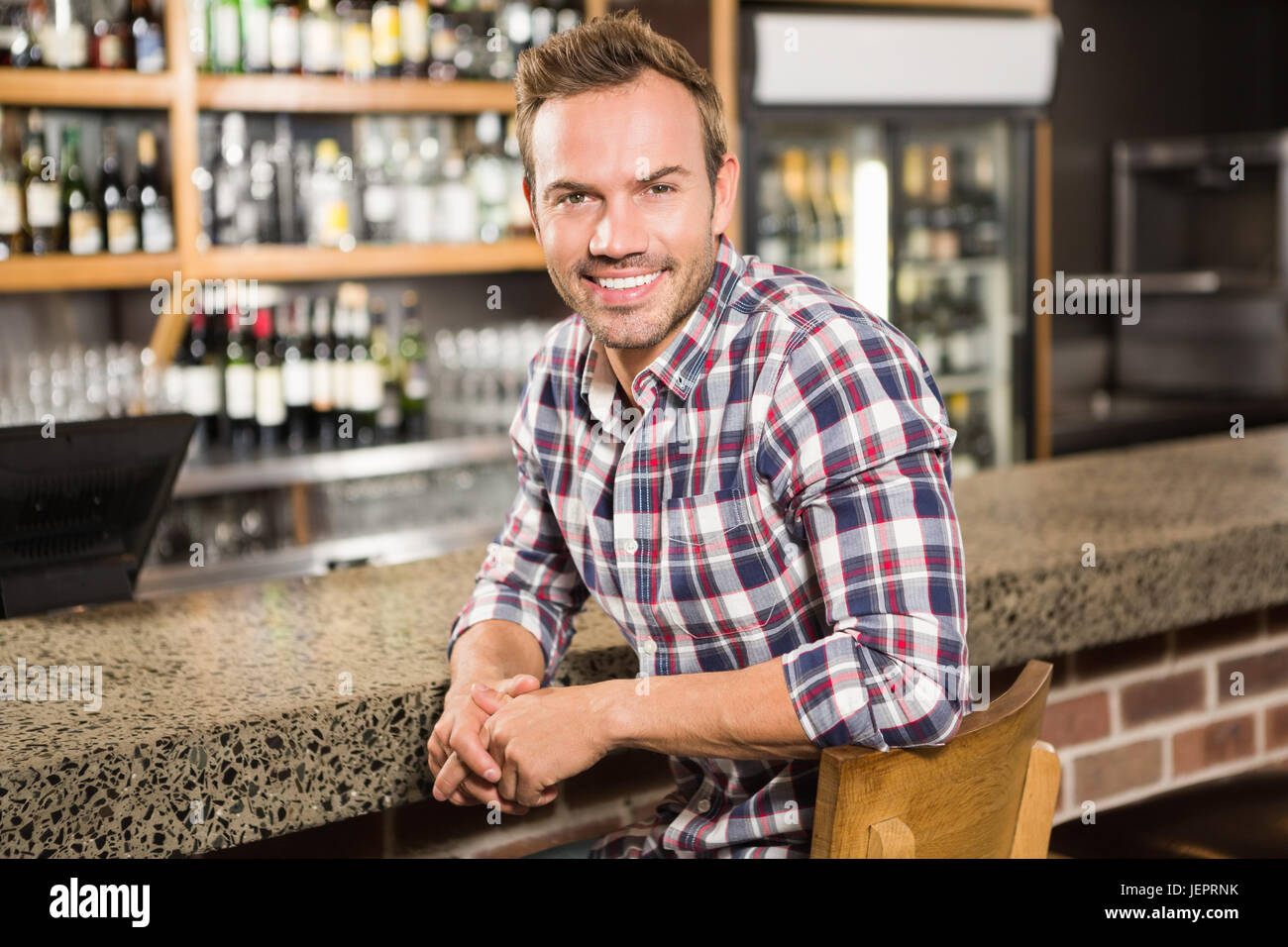 Leaning on counter hi-res stock photography and images - Alamy