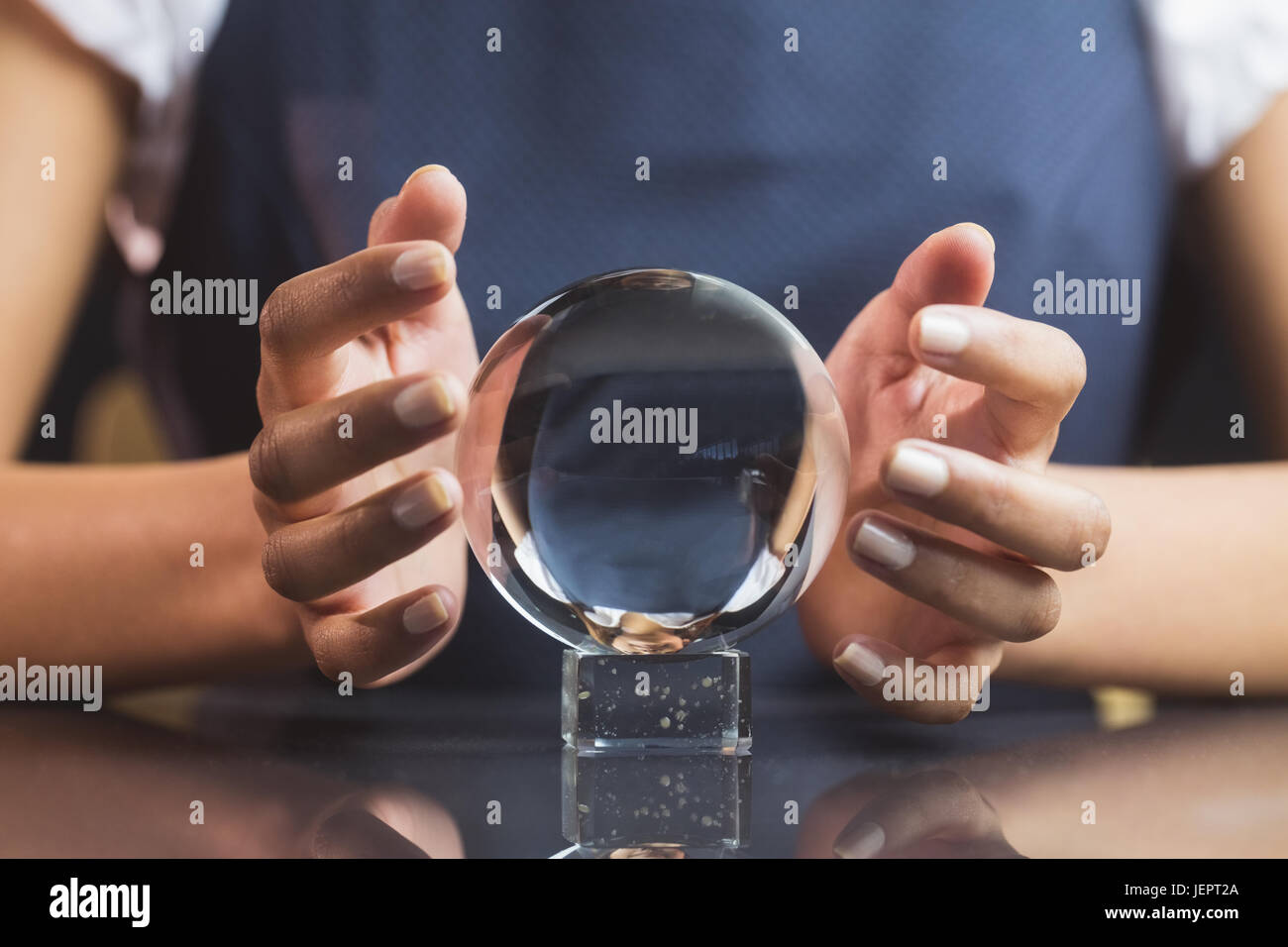 Young woman using crystal ball hi-res stock photography and images - Alamy