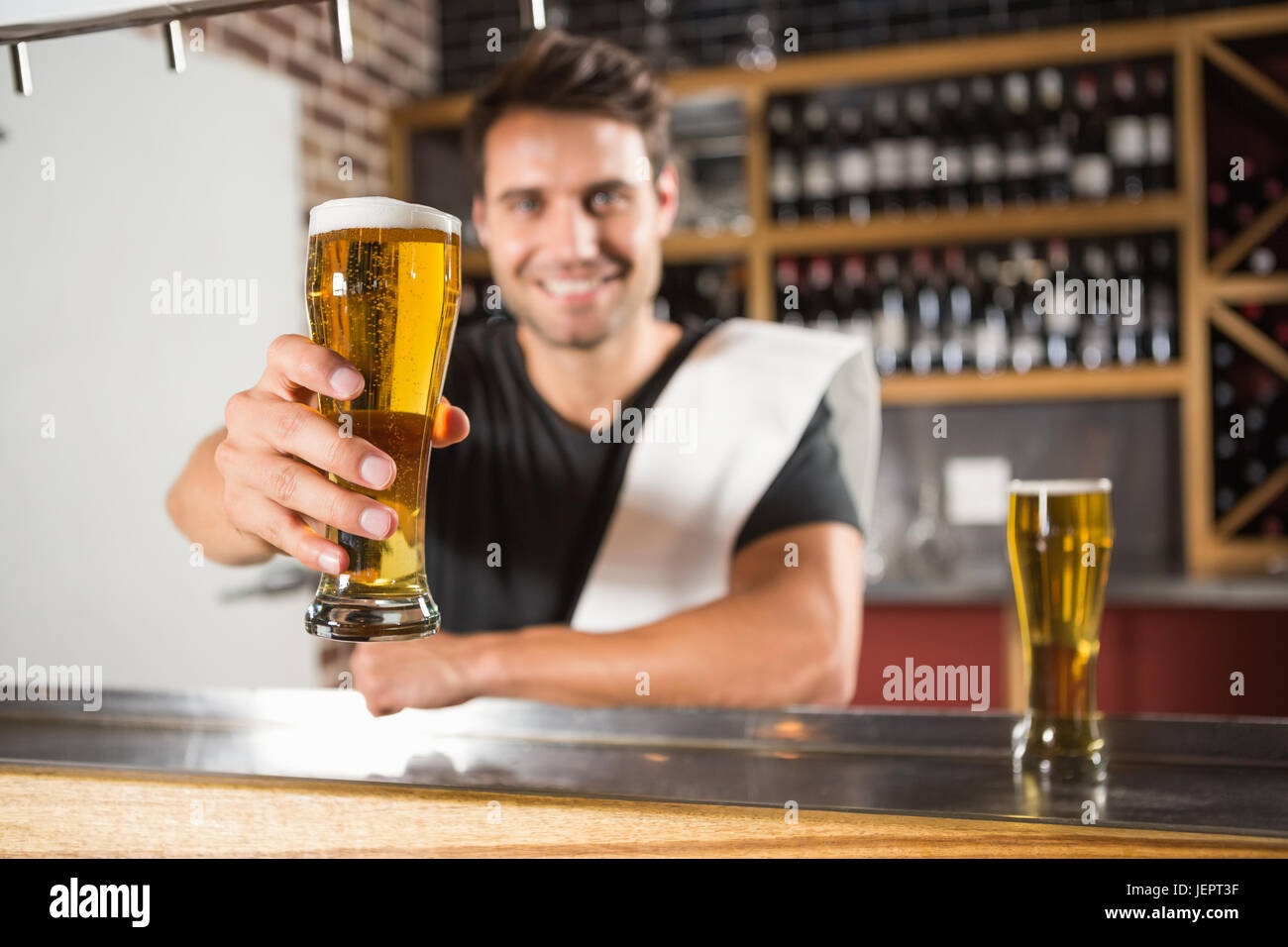 Barman giving beer hi-res stock photography and images - Alamy