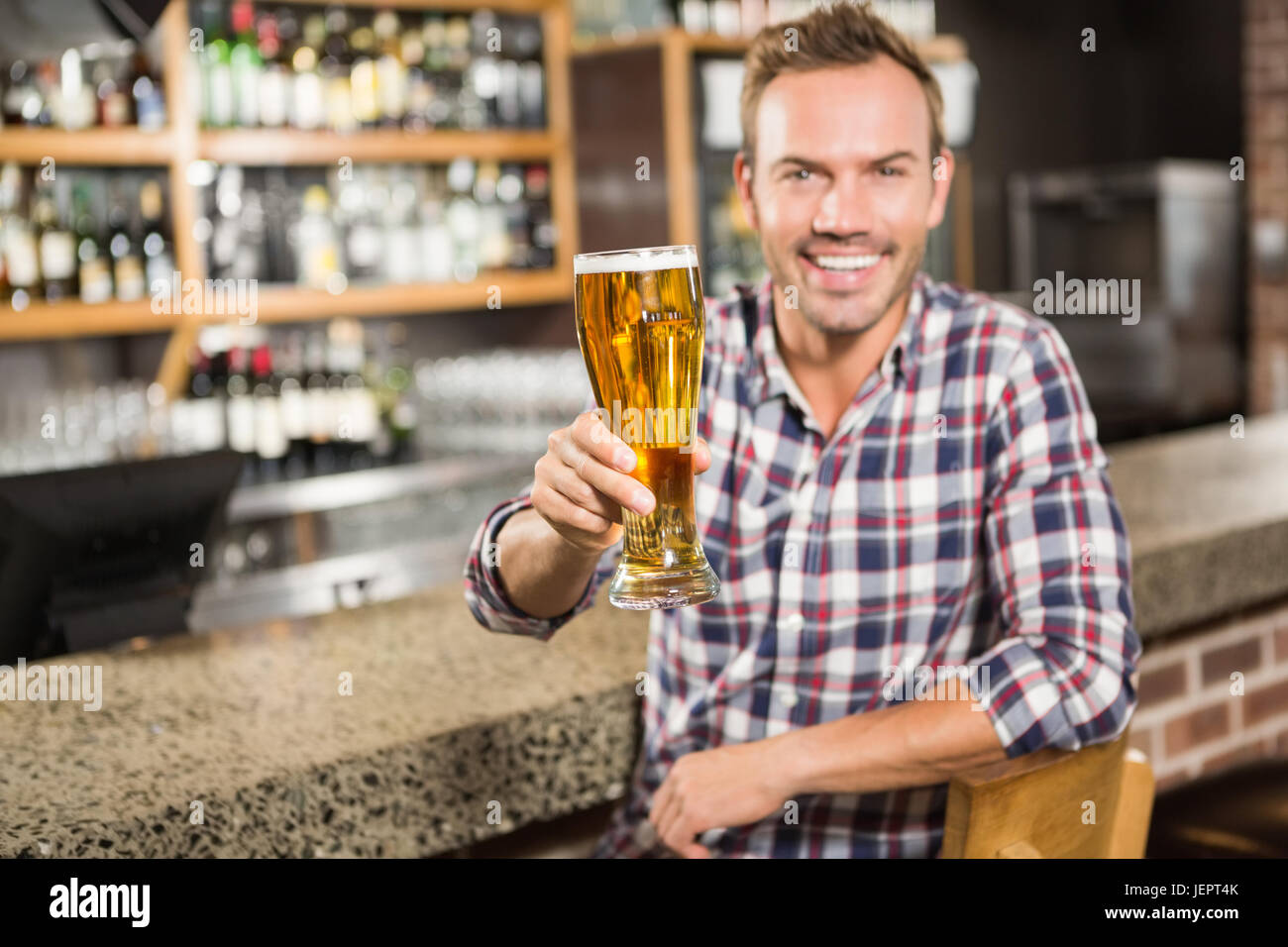 Handsome man having a beer Stock Photo - Alamy