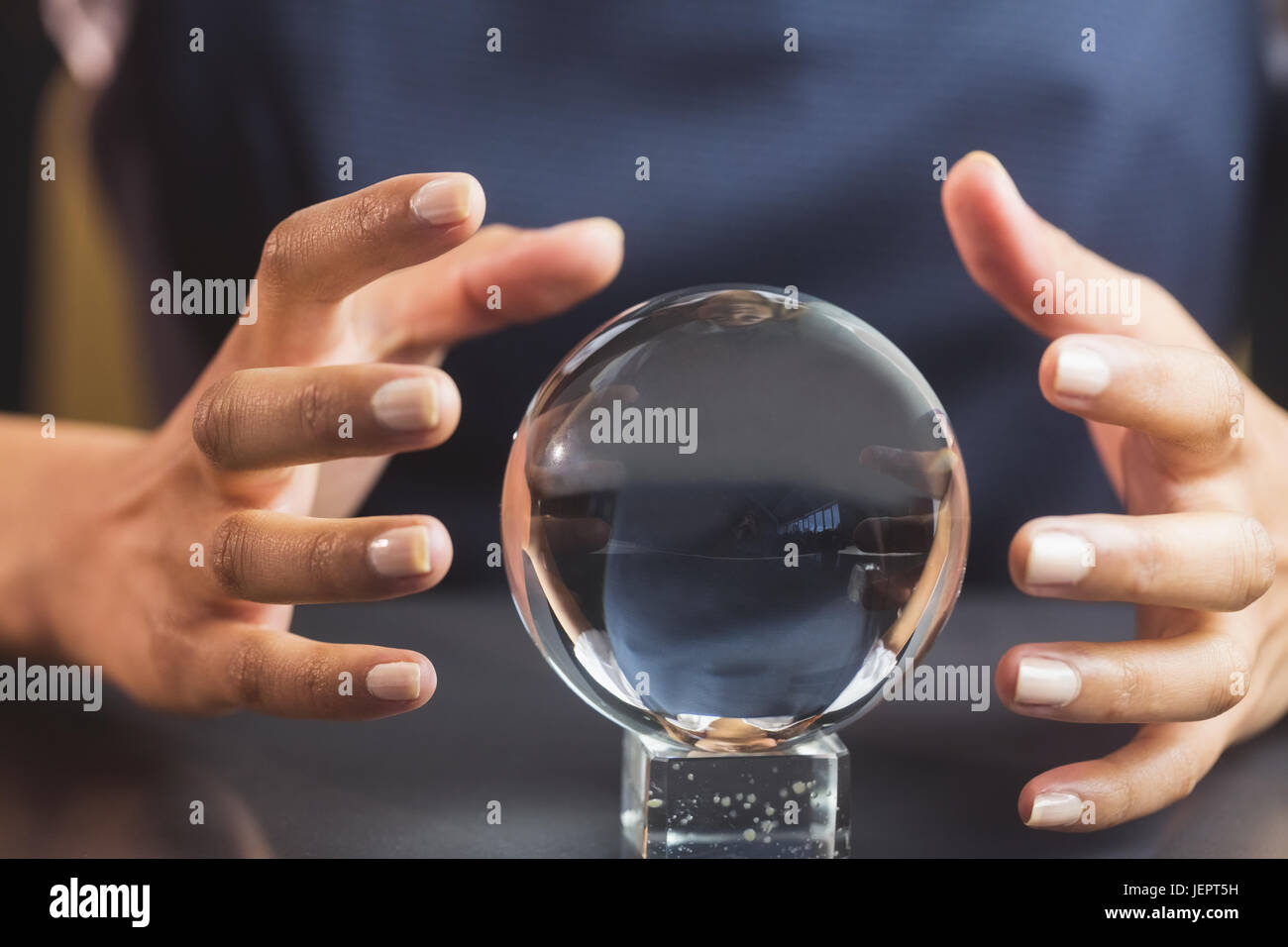 Businesswoman using crystal ball Stock Photo - Alamy