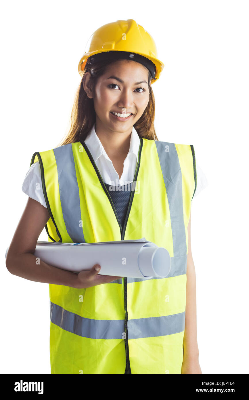 Architect woman with yellow helmet and plans Stock Photo - Alamy