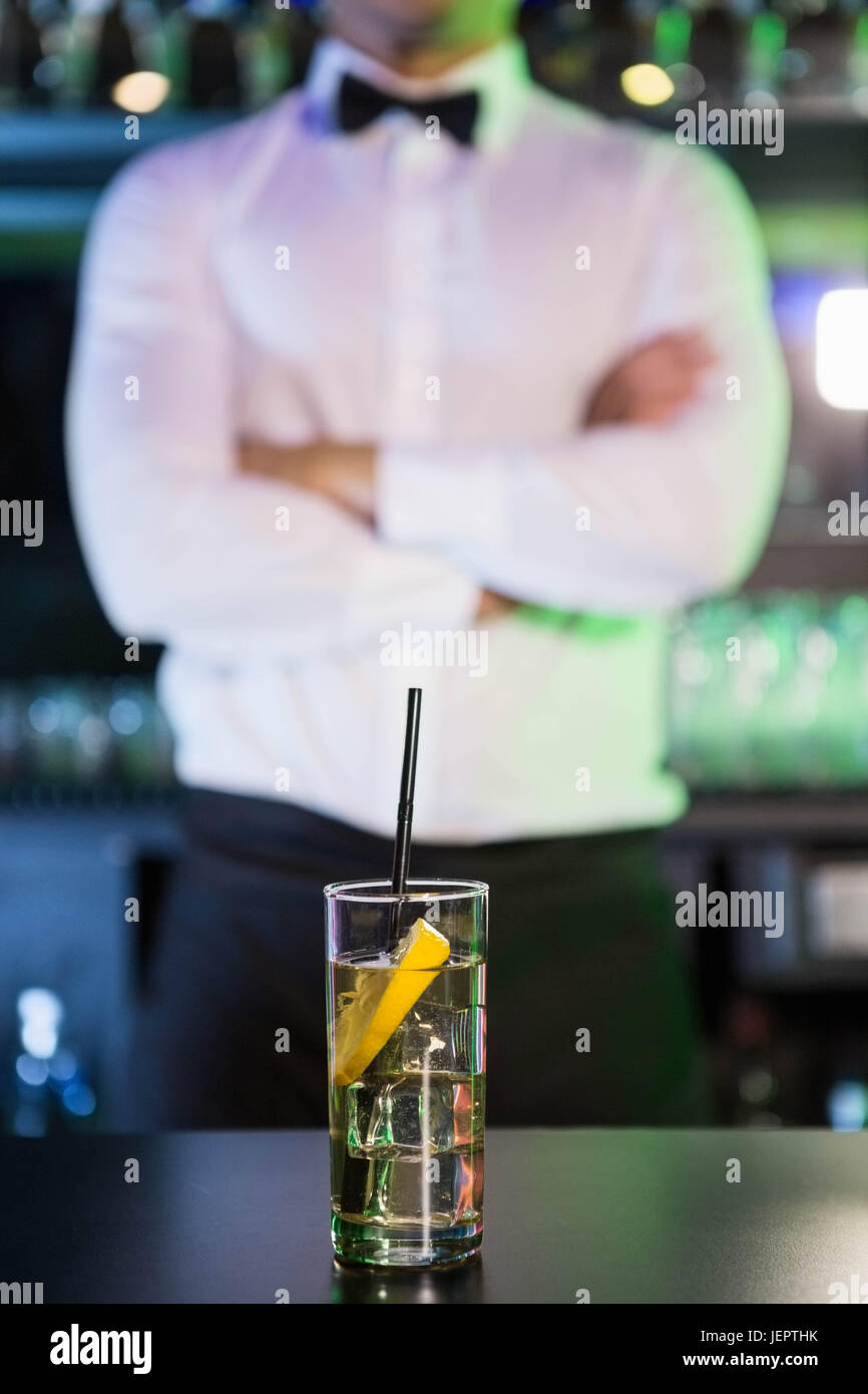 Glass of gin on bar counter Stock Photo - Alamy