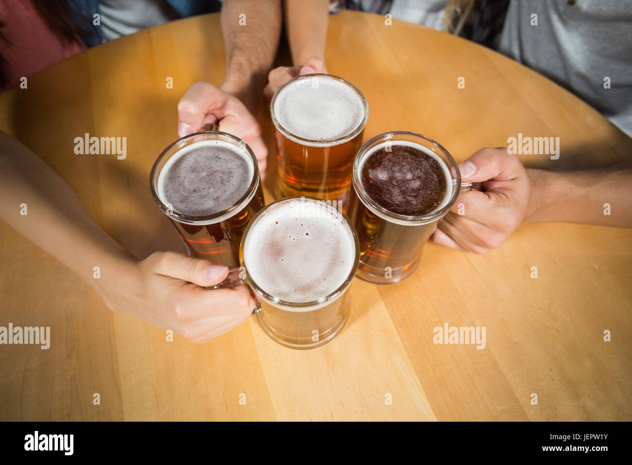 Friends toasting with beers Stock Photo - Alamy