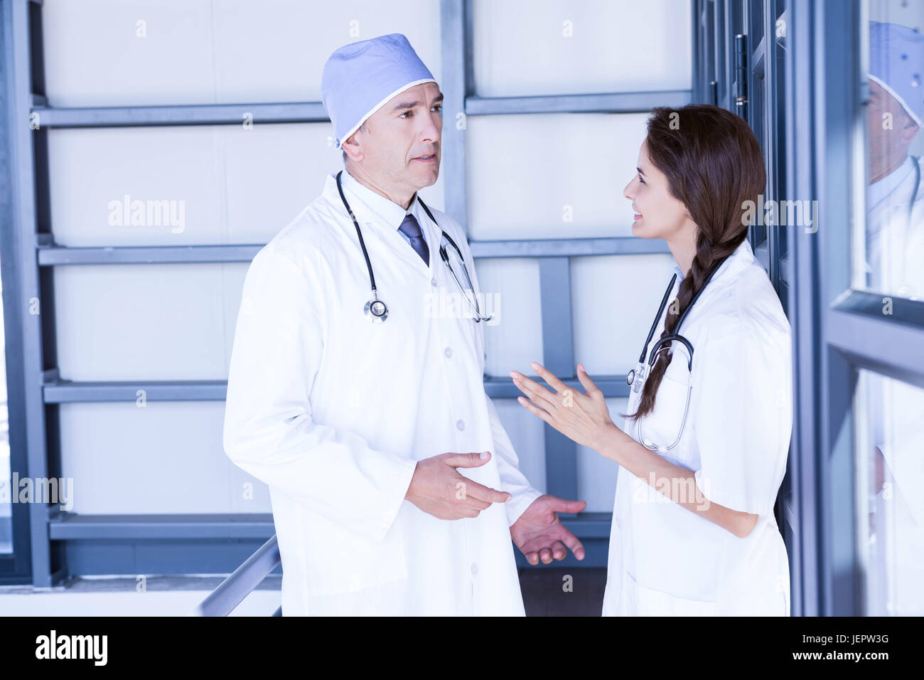 Doctors interacting with each other Stock Photo - Alamy