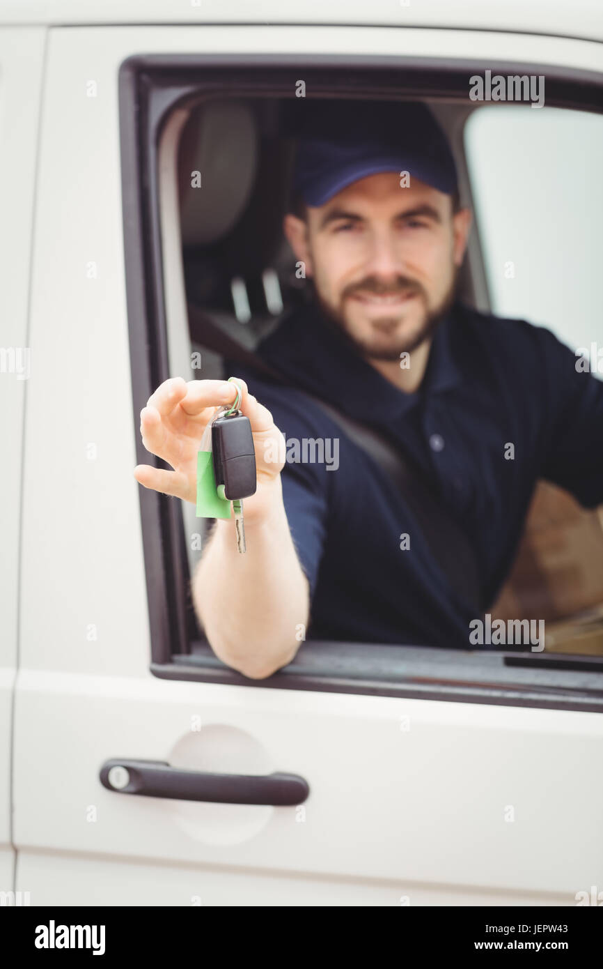 Delivery man sitting in his van Stock Photo - Alamy