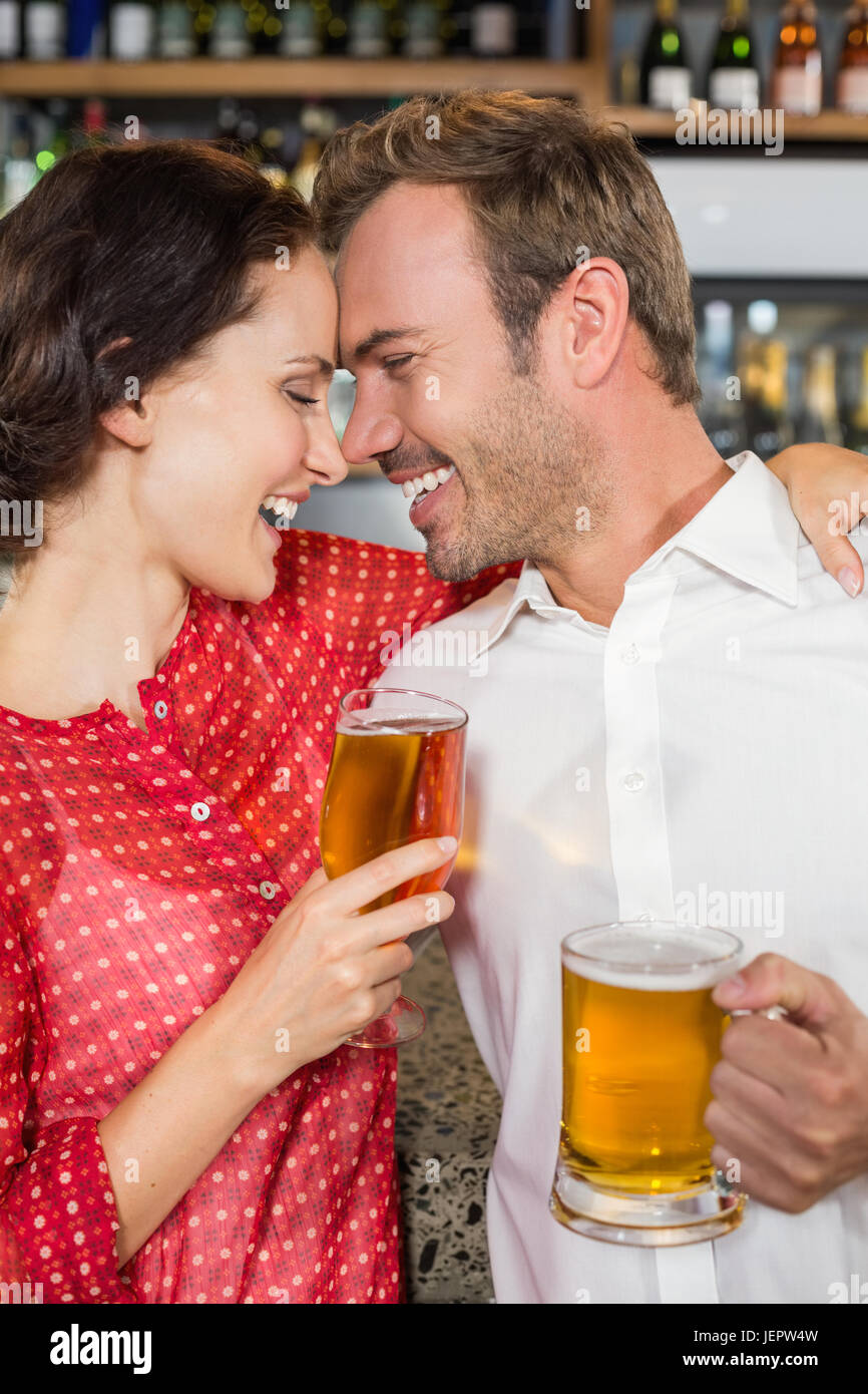 Couple head to head smiling Stock Photo - Alamy