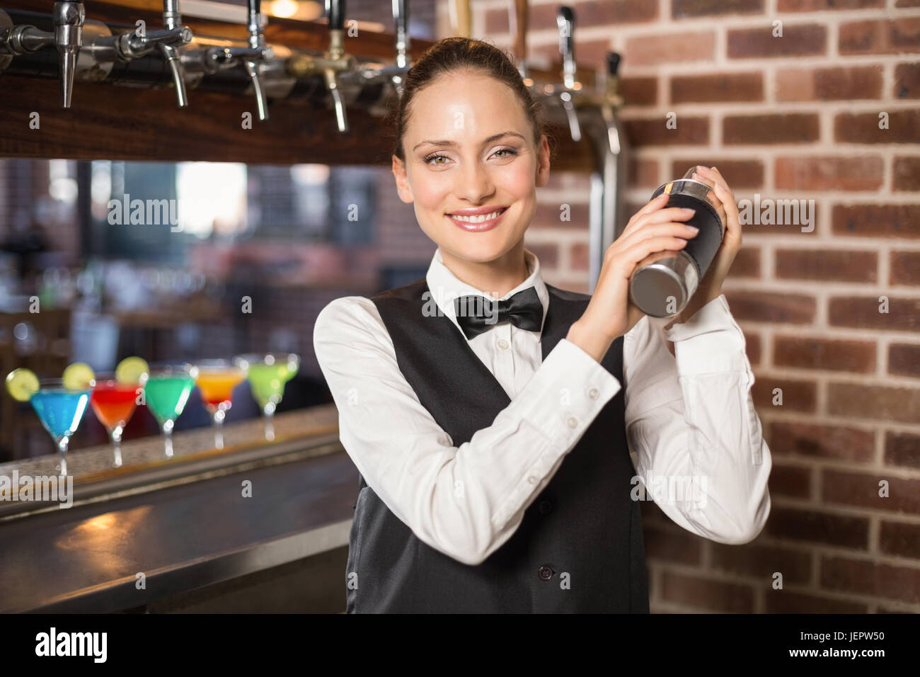 Barmaid shaking a cocktail Stock Photo - Alamy