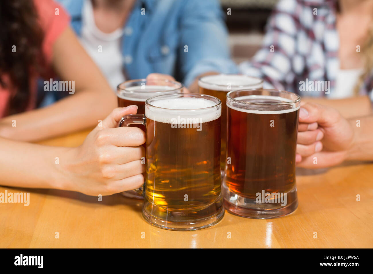 Friends toasting with beers Stock Photo - Alamy