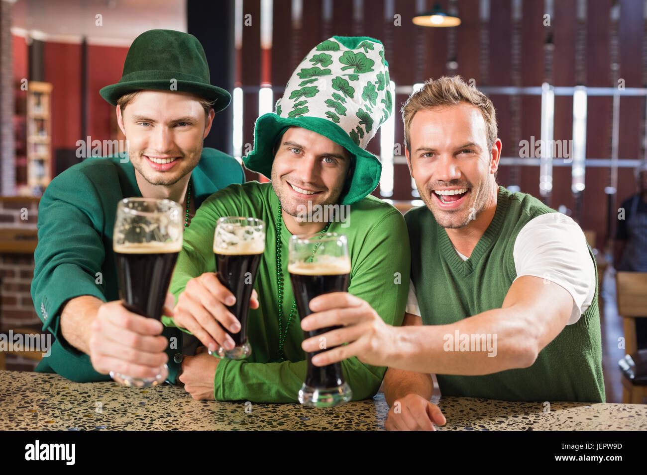 Men toasting with beers Stock Photo - Alamy
