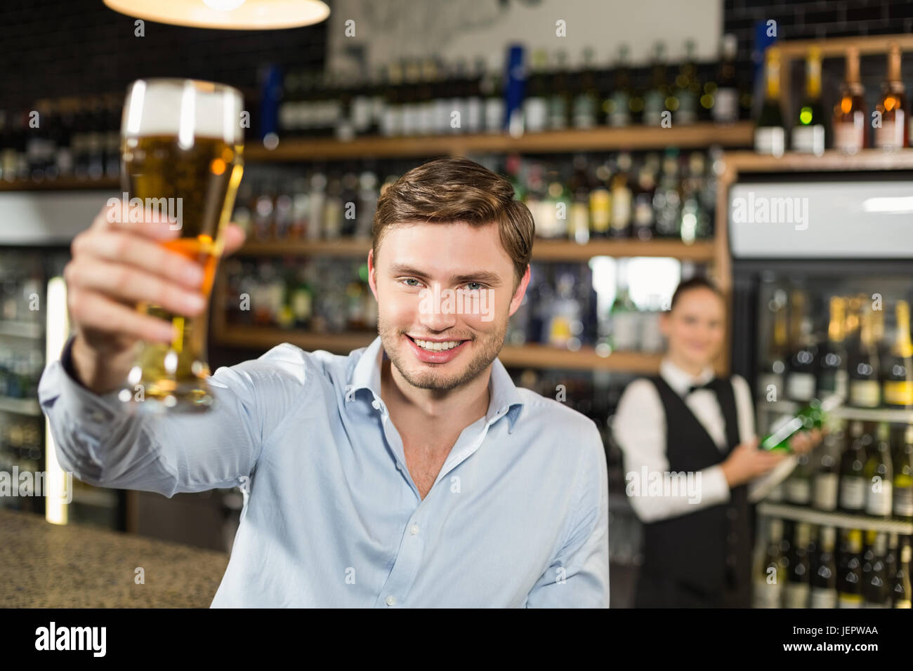 Man toasting a beer Stock Photo - Alamy