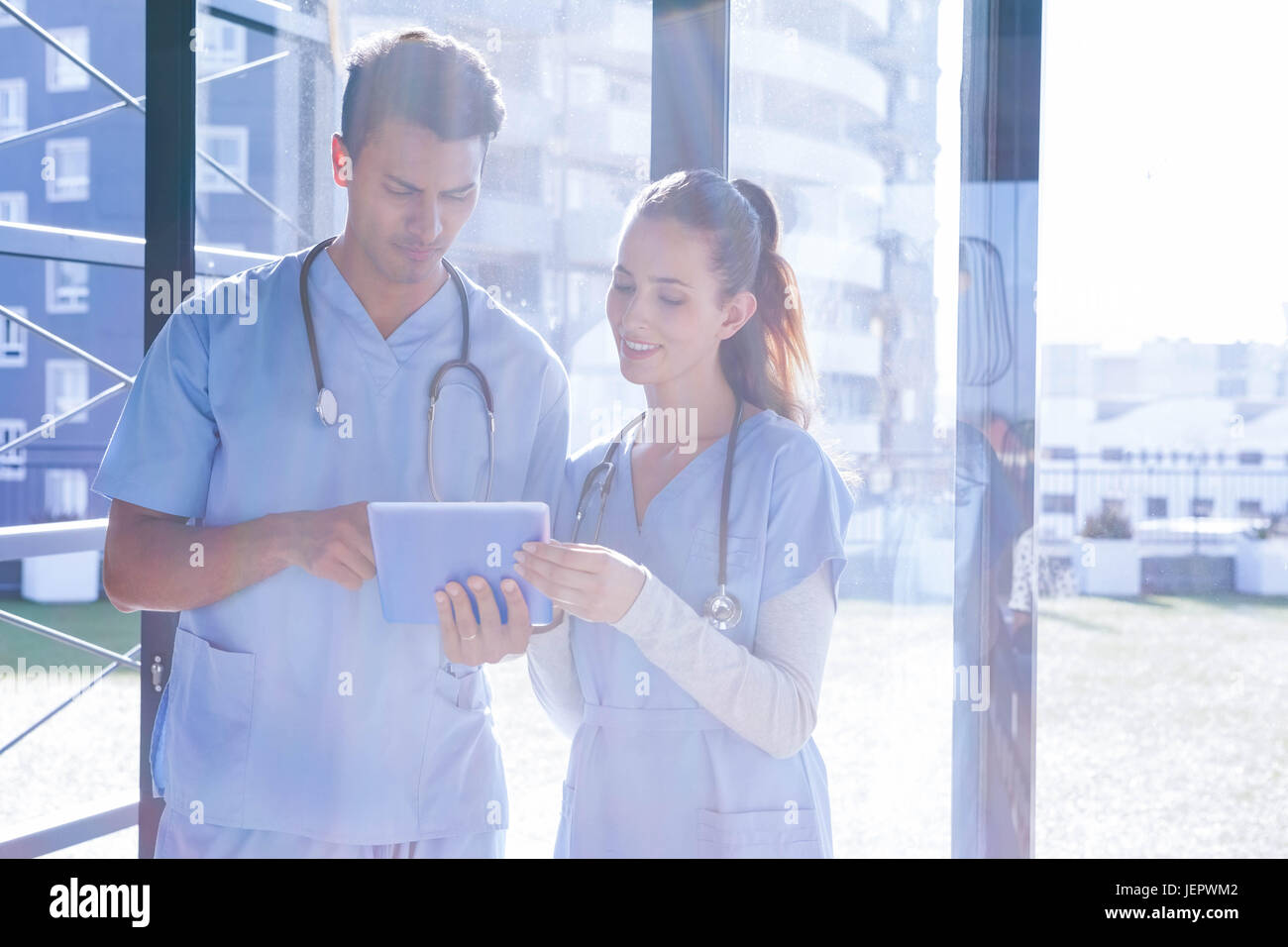 Young indian doctor using digital hi-res stock photography and images - Alamy