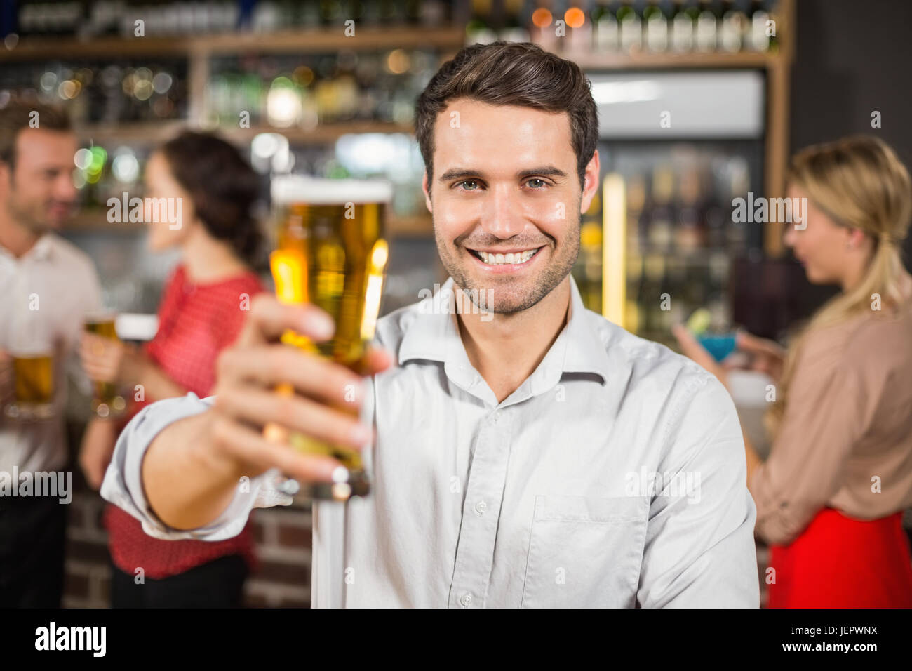 Young man smiling at camera Stock Photo - Alamy