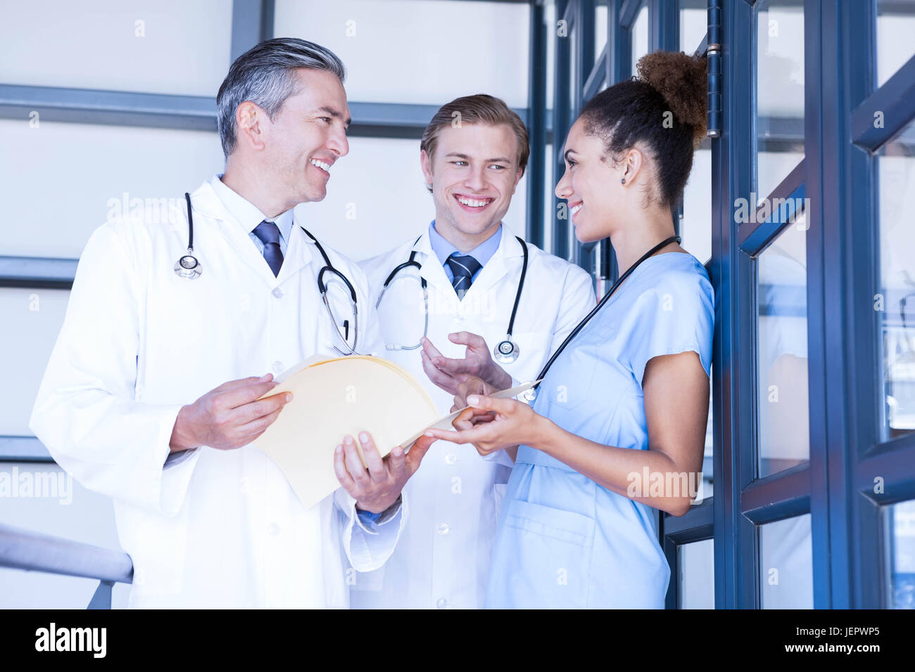 Medical team interacting with each other Stock Photo - Alamy