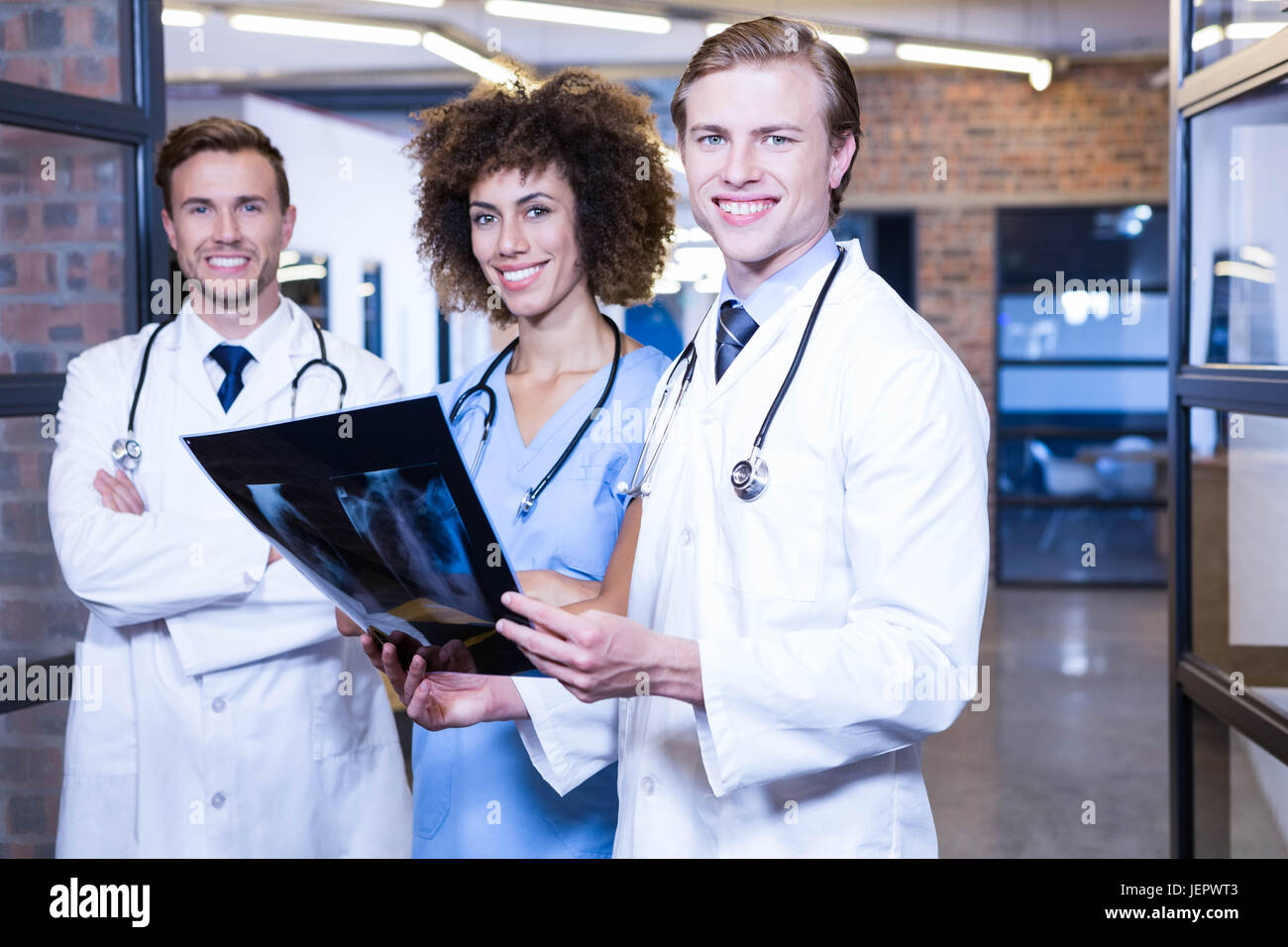 Group of doctors with xray report Stock Photo - Alamy