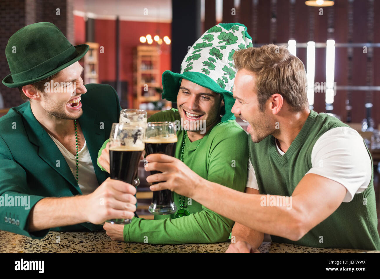 Men toasting beers Stock Photo - Alamy