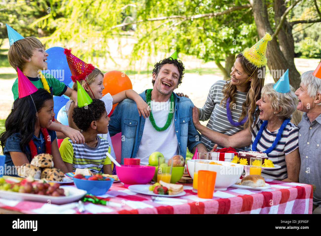 Happy family celebrating a birthday Stock Photo - Alamy