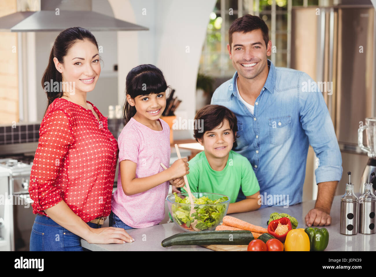 Parents children preparing vegetable hi-res stock photography and ...