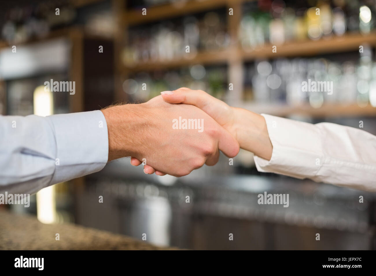 Two hands shaking Stock Photo - Alamy