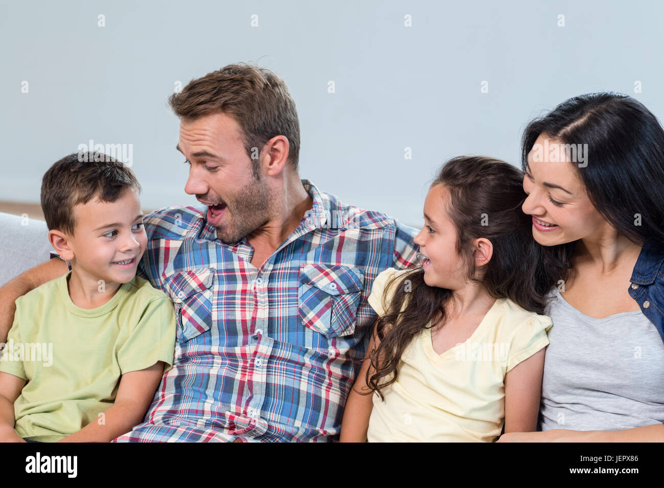 Parents interacting with their children Stock Photo - Alamy