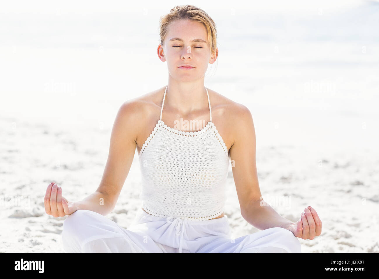 Beautiful woman in lotus position Stock Photo - Alamy