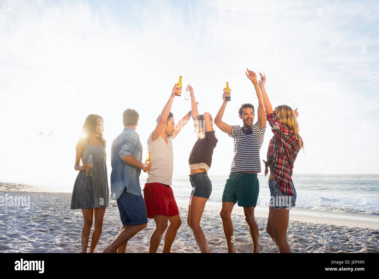 Happy friends dancing together Stock Photo - Alamy