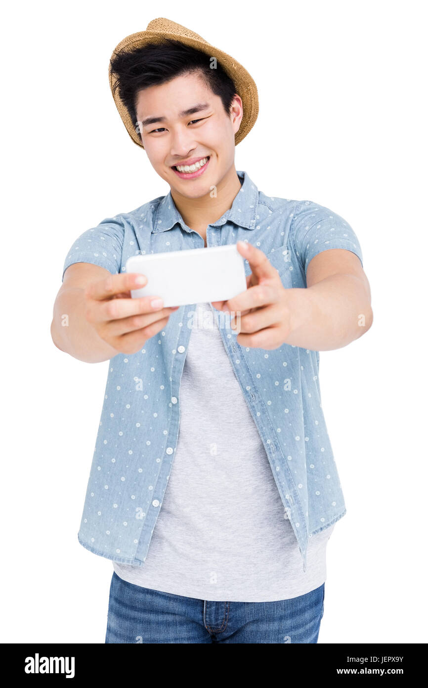 Young man clicking a selfie Stock Photo - Alamy