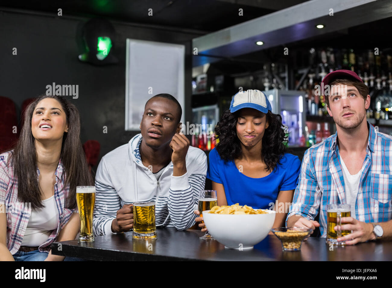 Friends disappointing by the match Stock Photo - Alamy