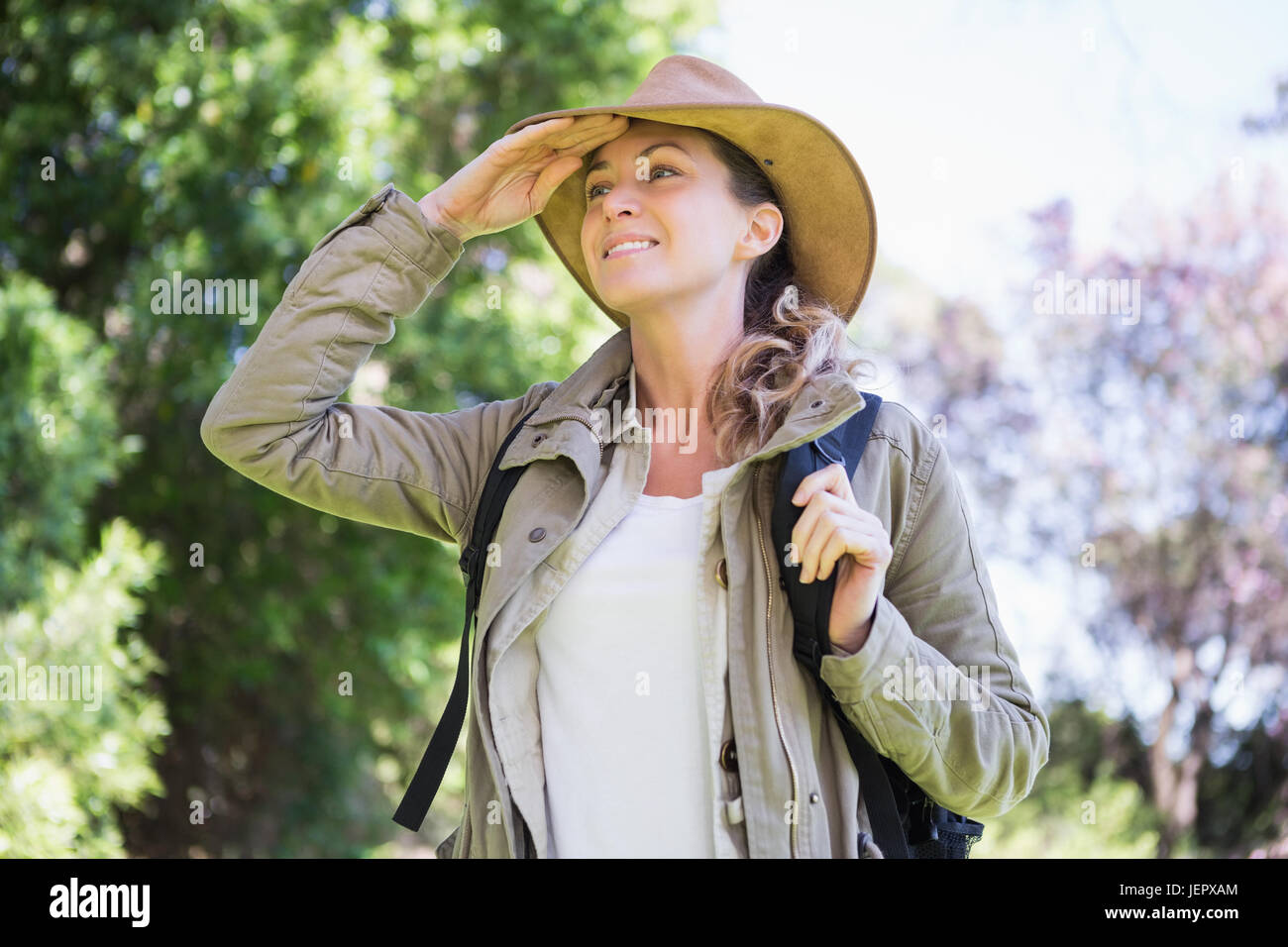 Woman observing something Stock Photo - Alamy