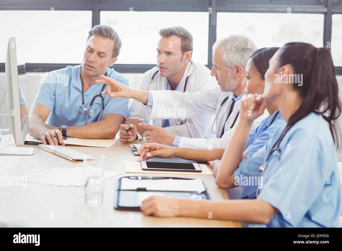 Medical team interacting in conference room Stock Photo - Alamy