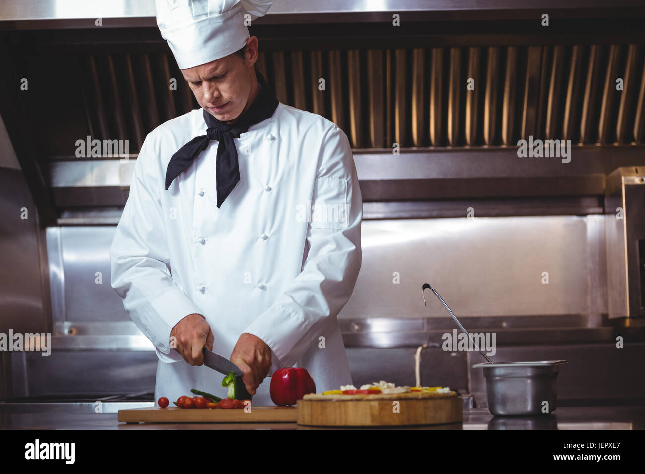 Chef slicing vegetables Stock Photo - Alamy