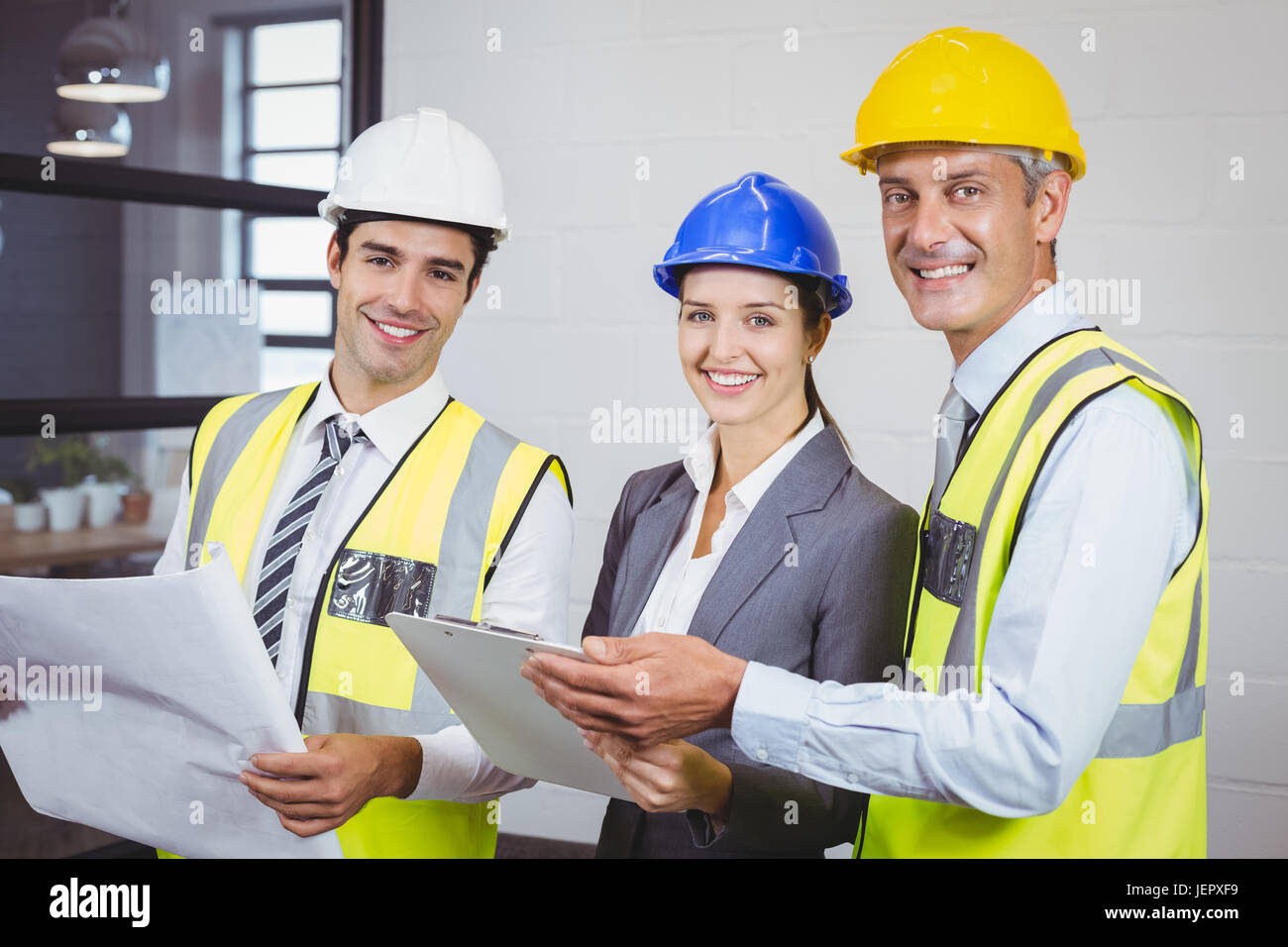 Portrait of smiling architects Stock Photo - Alamy
