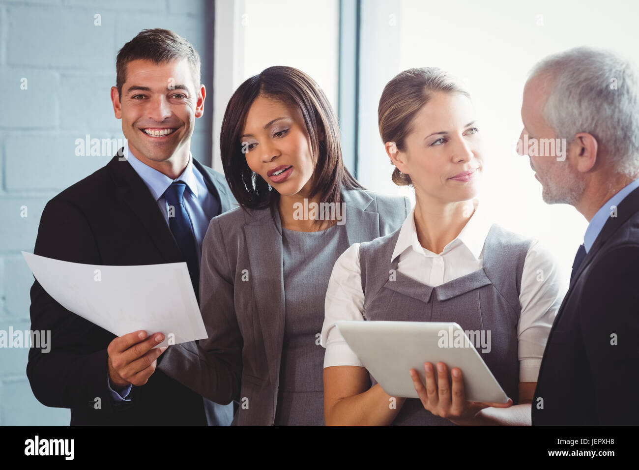 Businesspeople working in office Stock Photo - Alamy