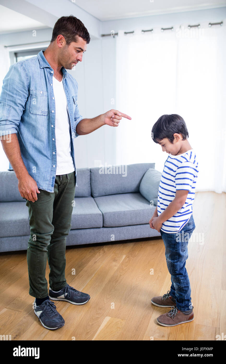 Angry father scolding his son Stock Photo - Alamy