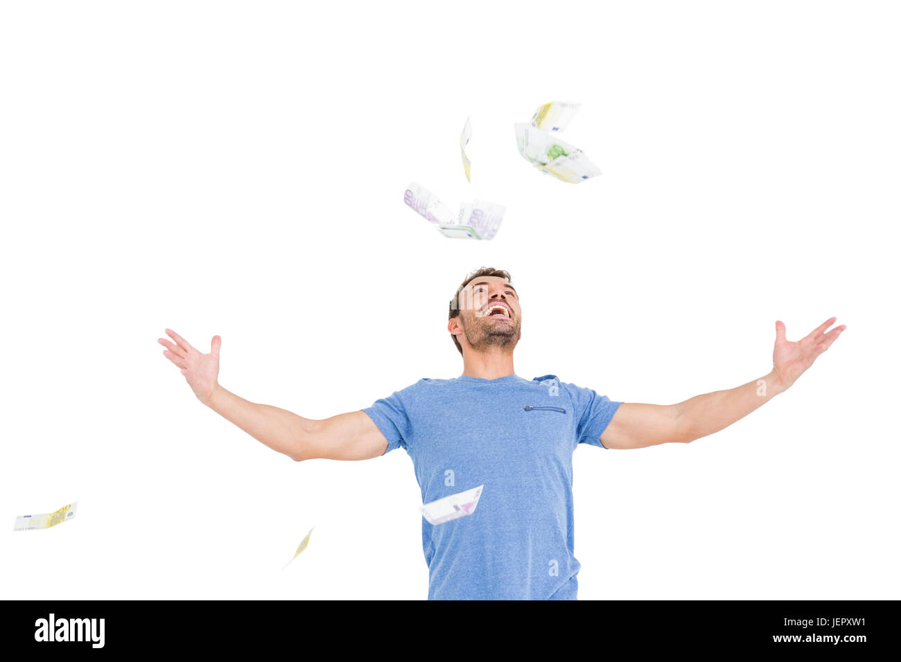 Young man throwing currency notes Stock Photo - Alamy
