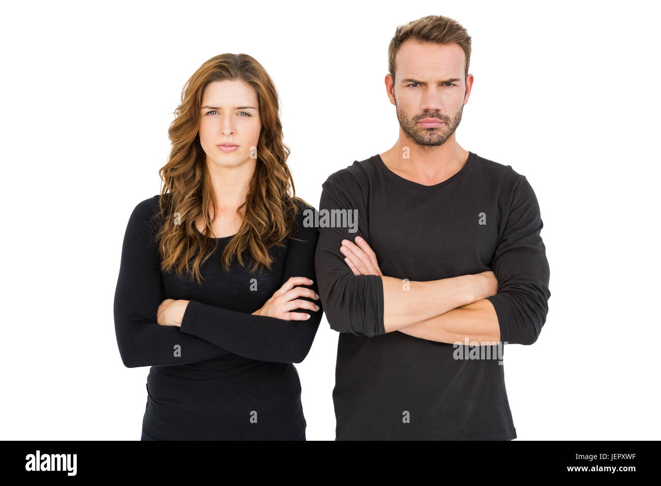Upset couple standing with arms crossed Stock Photo - Alamy