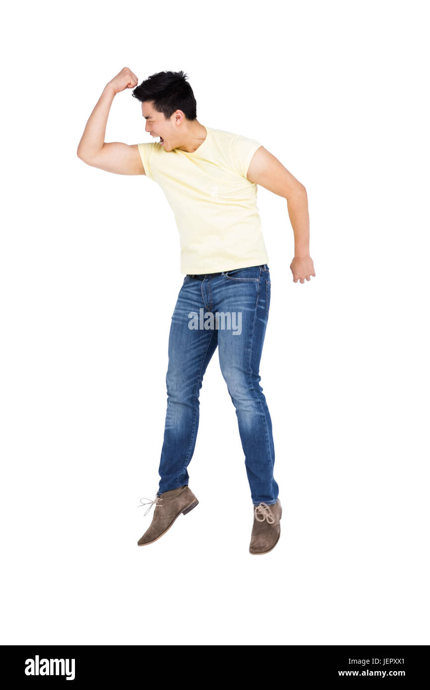 Happy man jumping in excitement Stock Photo - Alamy