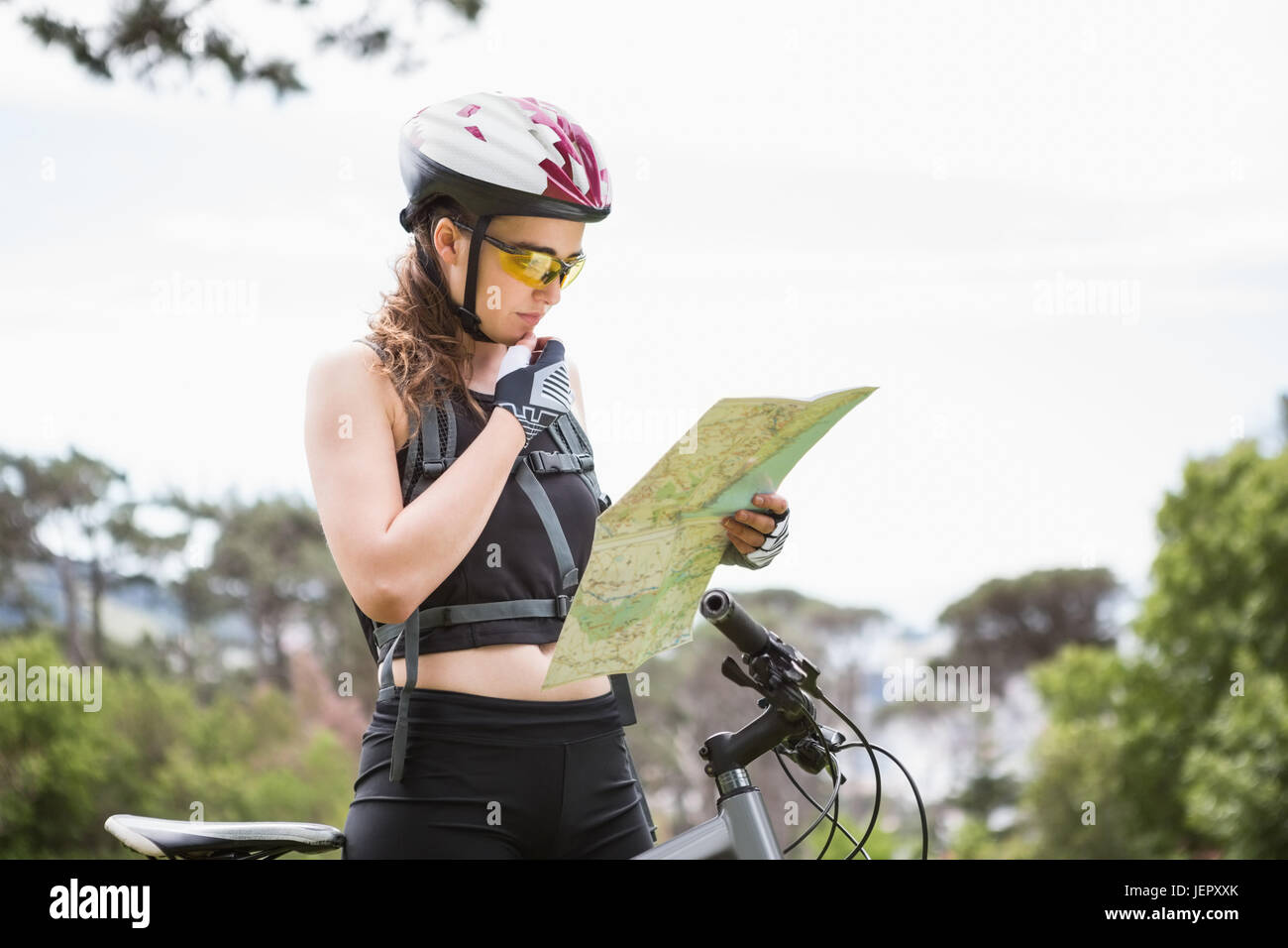 Woman checking the map Stock Photo - Alamy