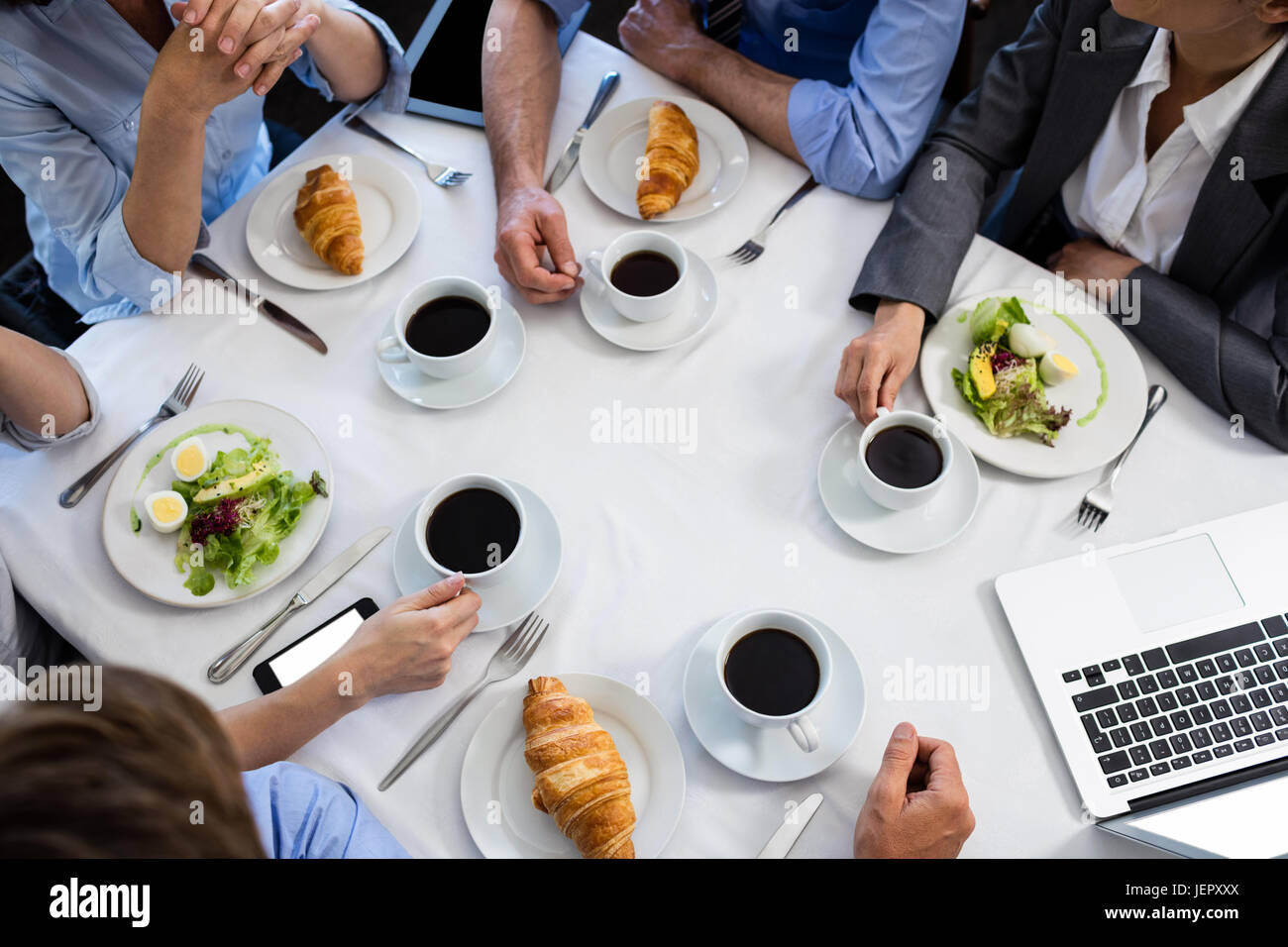 Table in restaurant during business meeting Stock Photo - Alamy