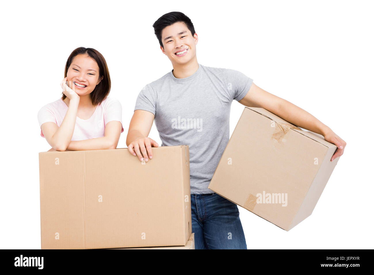 Young couple with cardboard boxes Stock Photo - Alamy