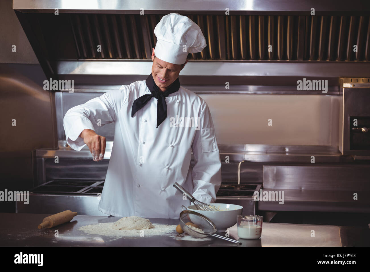 Focused chef preparing a cake Stock Photo - Alamy