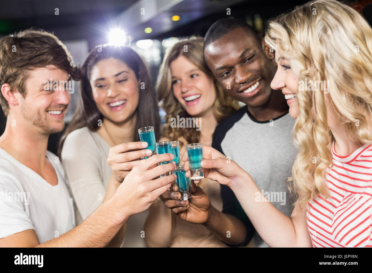 Friends toasting with shots Stock Photo - Alamy