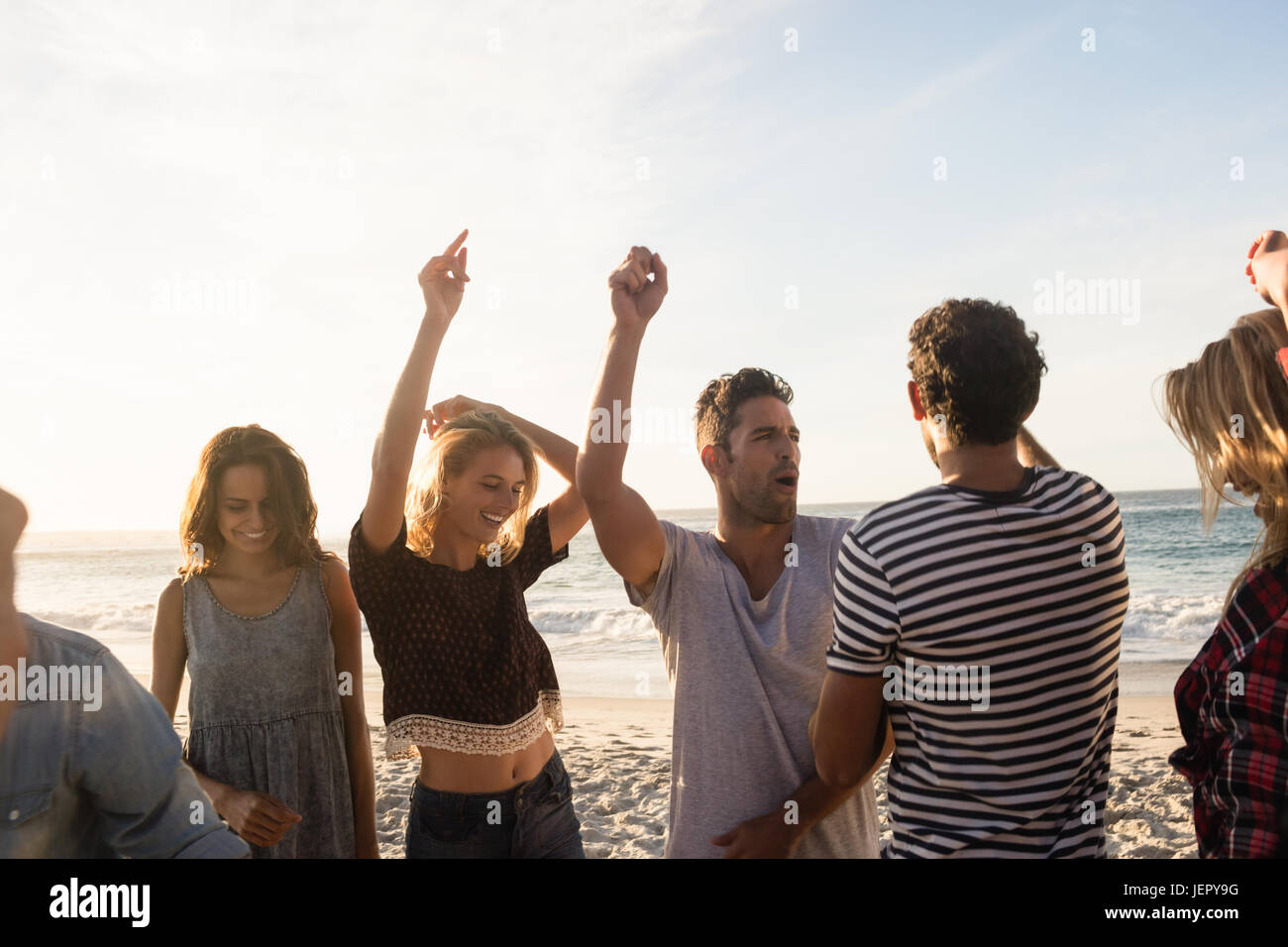 Happy friends dancing together Stock Photo - Alamy
