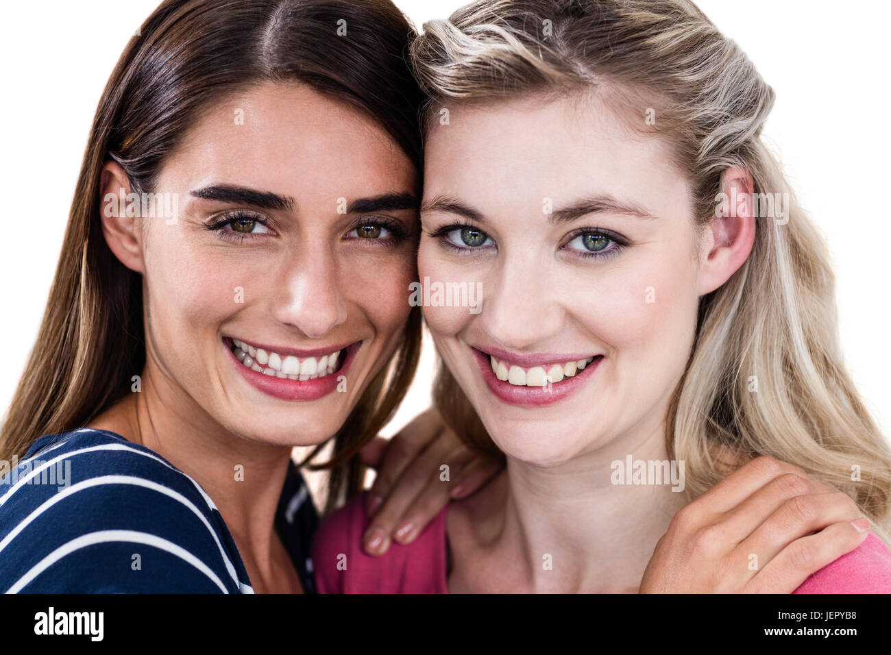 Portrait of happy female friends hugging Stock Photo - Alamy